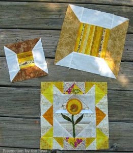 Scrappy Yellow quilt block with applique flower - Freemotion by the River